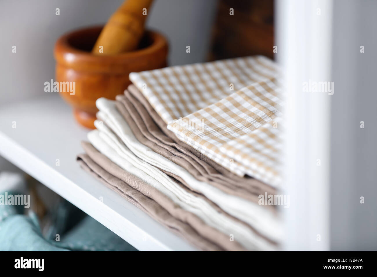 Clean kitchen towels on shelf Stock Photo - Alamy