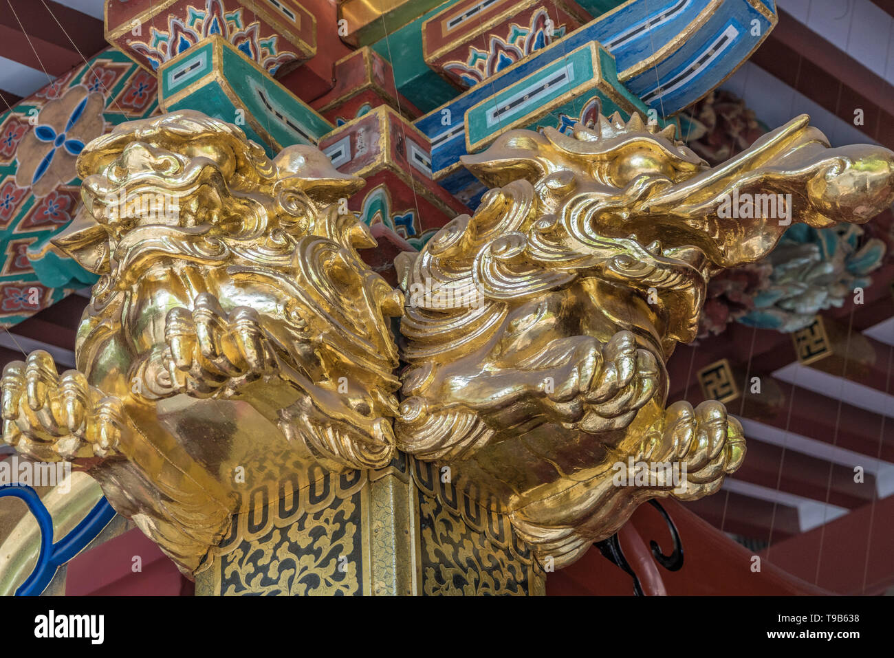 Wood carved Shishi Lion and Baku Tapir Nosing golden ornaments at ...