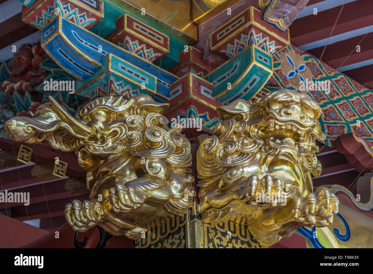 Wooden carved Shishi Lion and Baku Tapir Nosing golden ornaments at ...