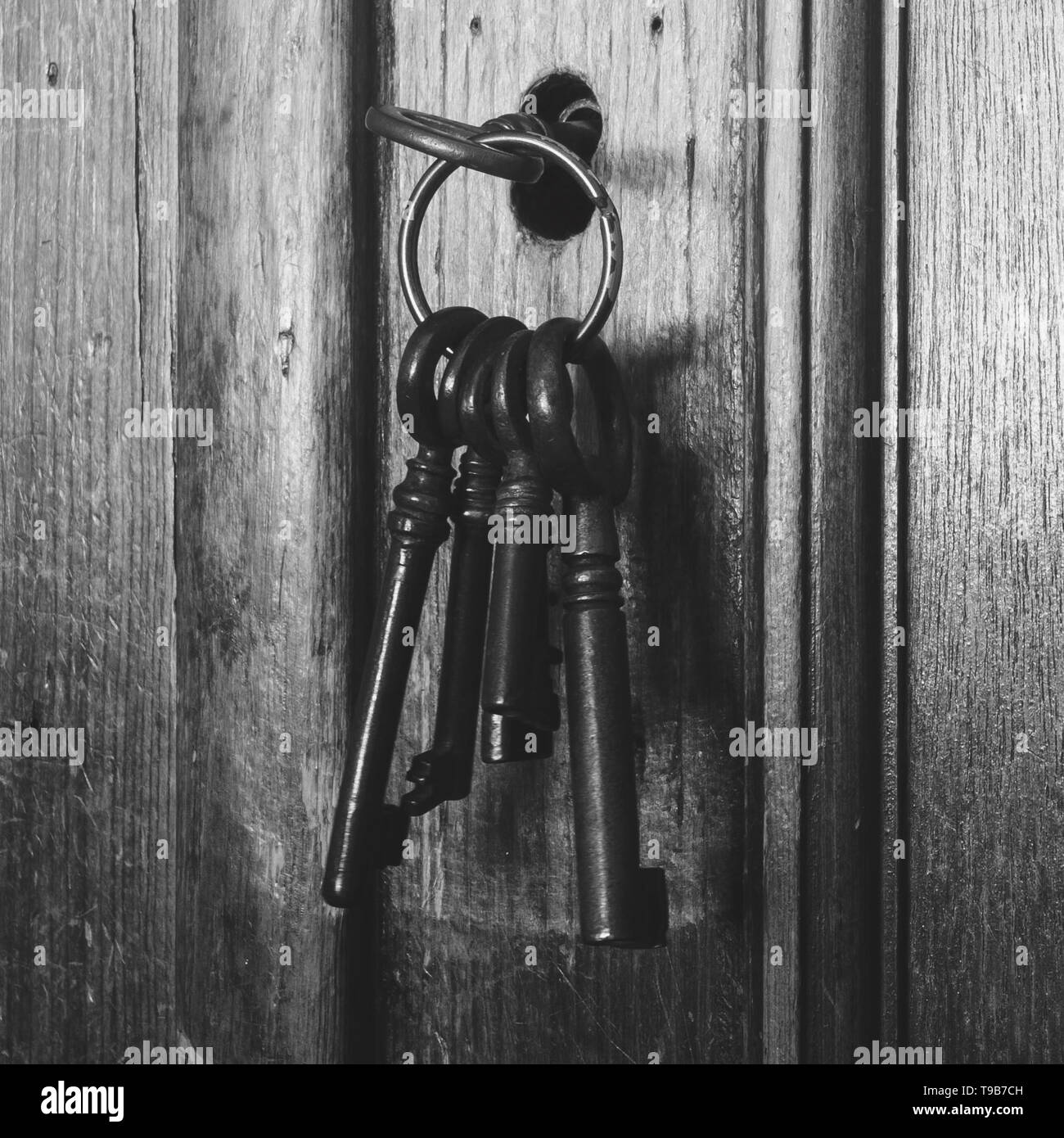 Old rusty keys inside a keyhole of an old antique closet. vintage ...