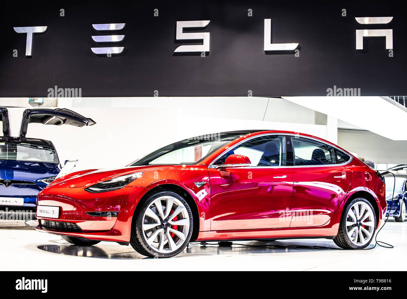 Brussels, Belgium, Jan 21, 2019: metallic red Tesla Model 3 at Brussels ...