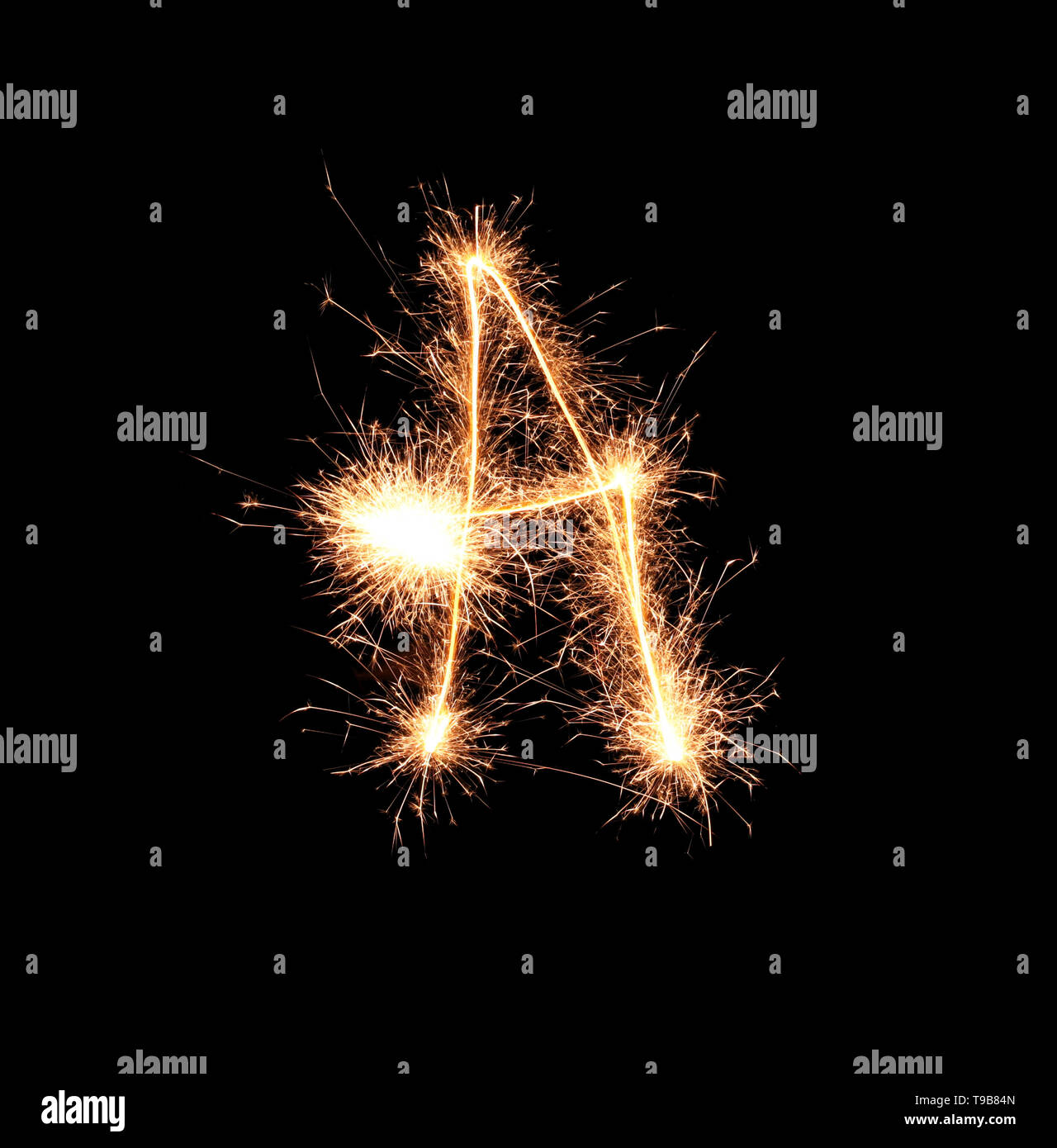 Sparklers forming letter A on dark background Stock Photo - Alamy