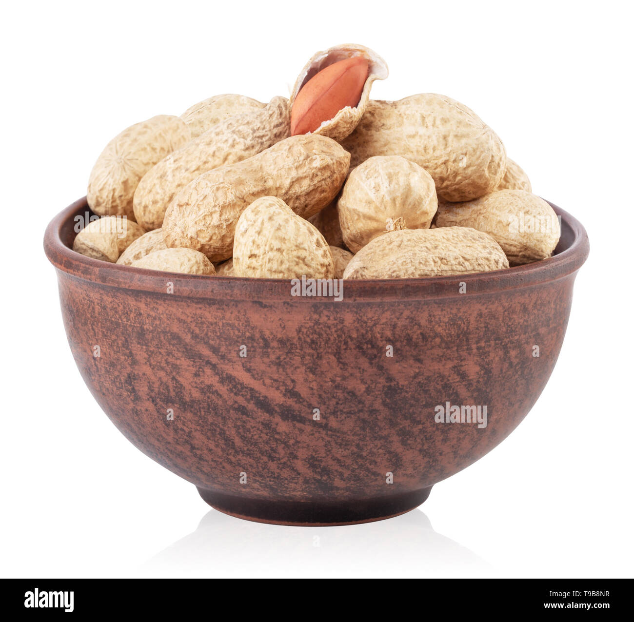 Peanut pods in clay plate Stock Photo - Alamy
