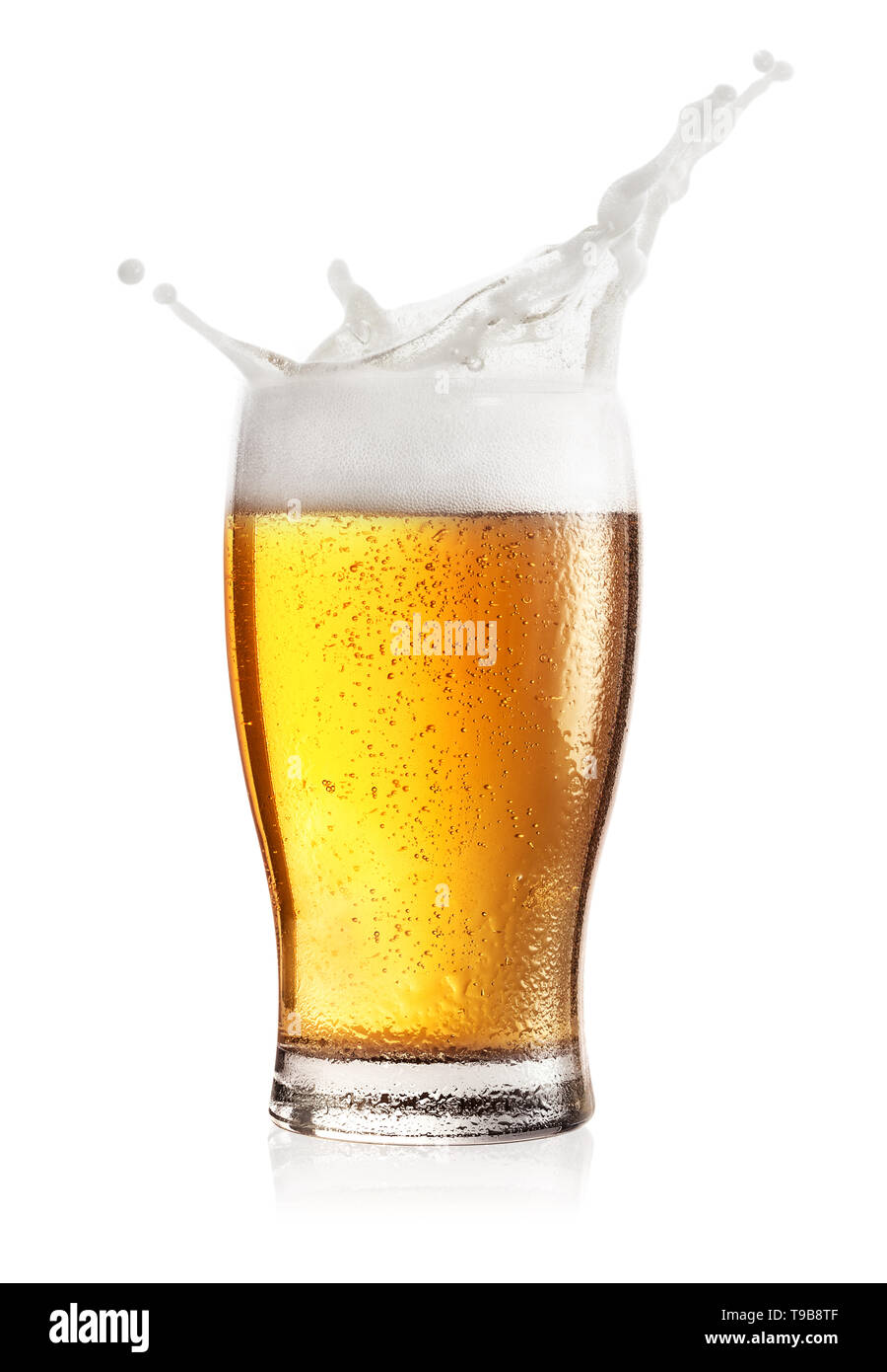 Steamed glass of light beer with splash Stock Photo - Alamy