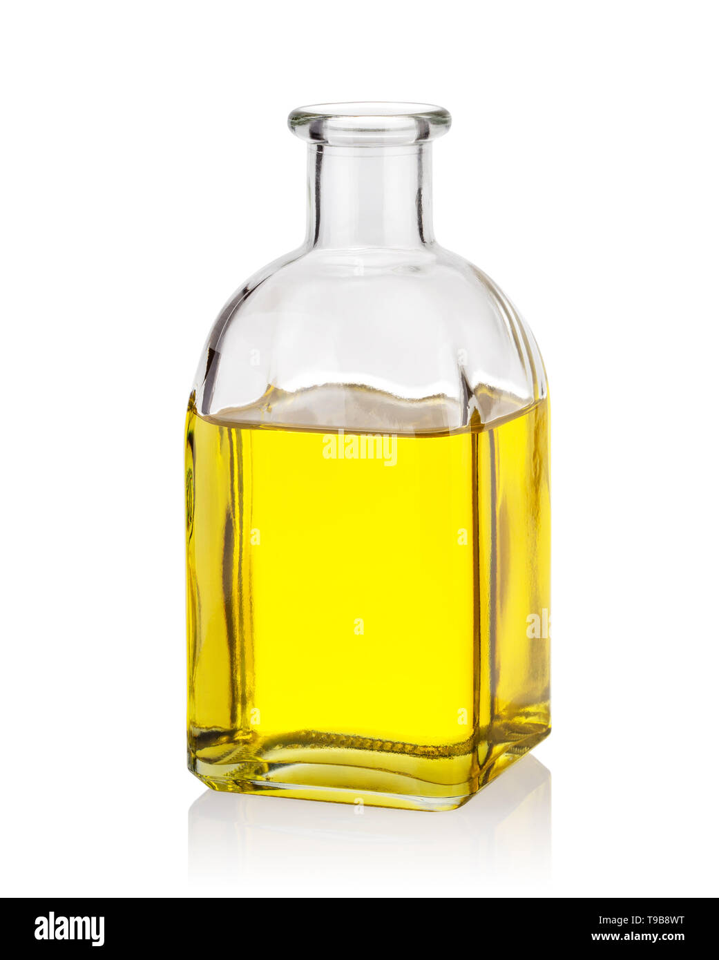Yellow oil in glass bottle Stock Photo - Alamy