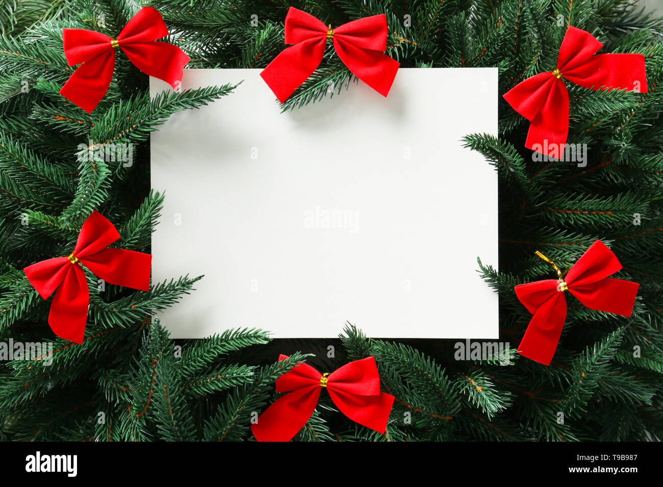 Blank paper sheet with fir tree branches and bows Stock Photo - Alamy