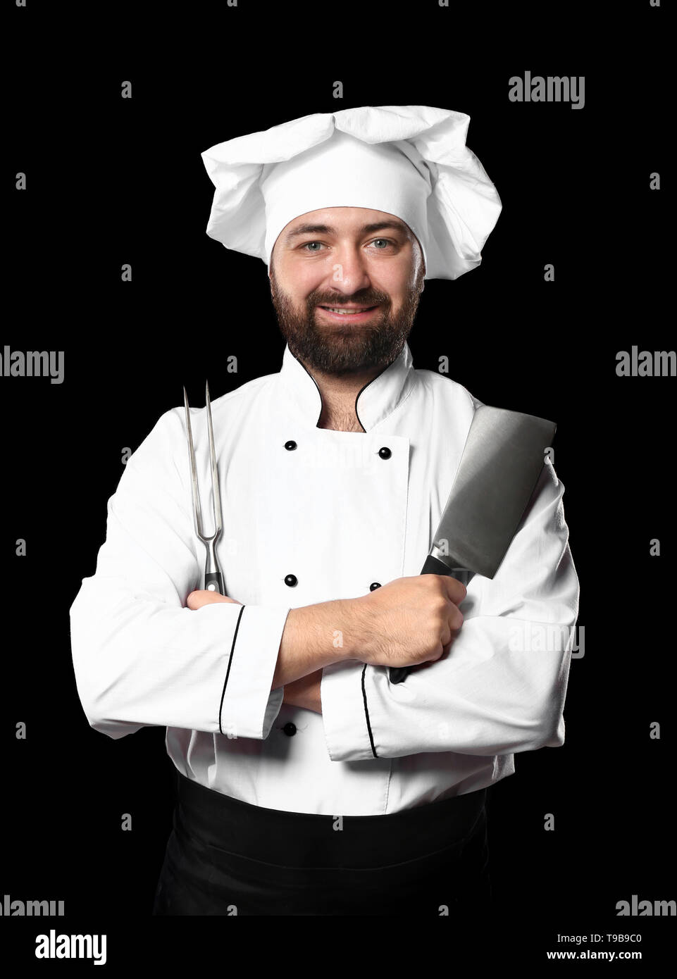 Male chef on dark background Stock Photo - Alamy