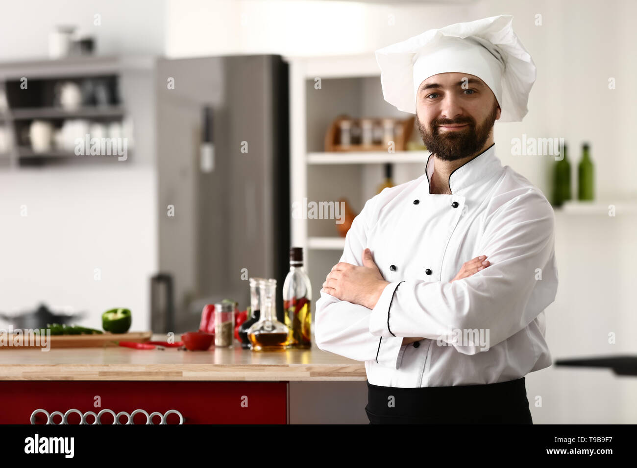 Male chef in restaurant kitchen Stock Photo - Alamy