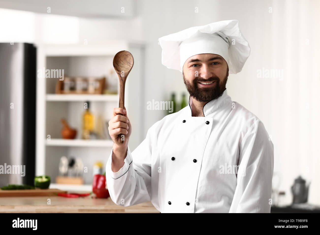 Male chef in restaurant kitchen Stock Photo - Alamy