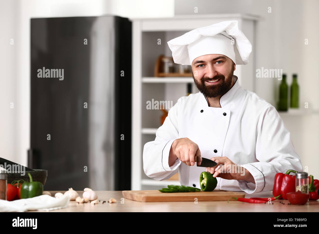 Male chef cooking in kitchen Stock Photo - Alamy