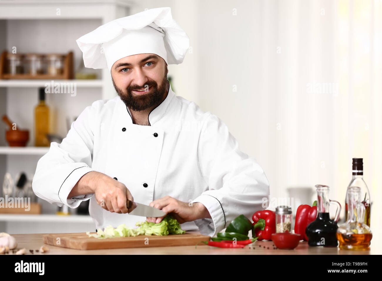 Male chef cooking in kitchen Stock Photo - Alamy