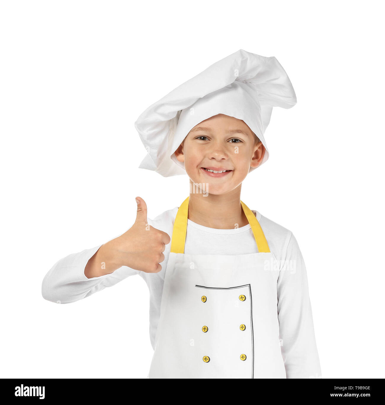 Cute little chef showing thumb-up on white background Stock Photo - Alamy
