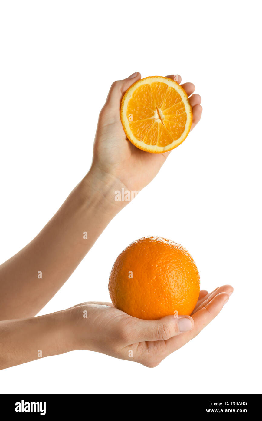 Female hands with oranges on white background Stock Photo - Alamy