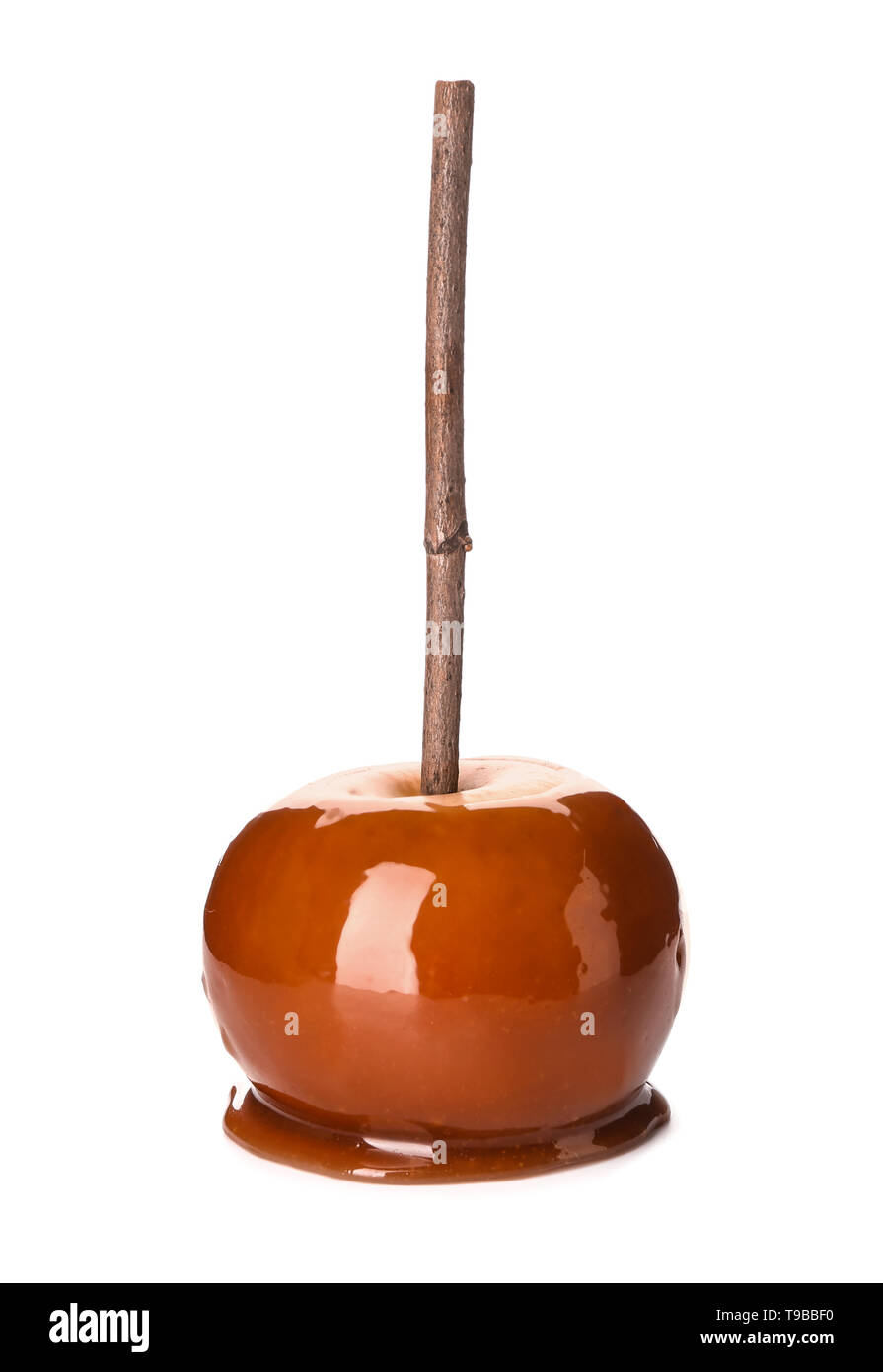 Delicious caramel apple with tree branch on white background Stock ...