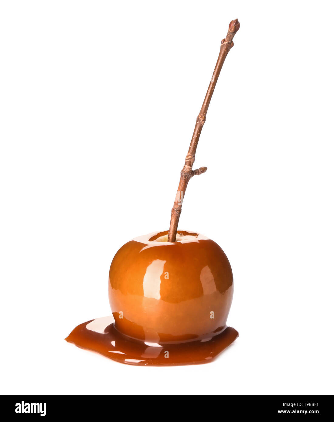 Delicious caramel apple with tree branch on white background Stock ...