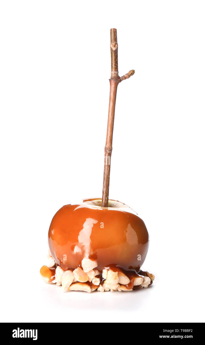 Delicious caramel apple with tree branch on white background Stock ...