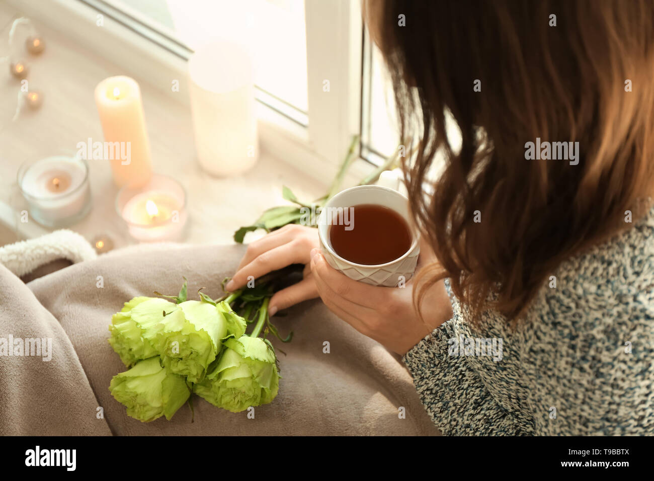 Woman sitting hands beauty window hi-res stock photography and images ...
