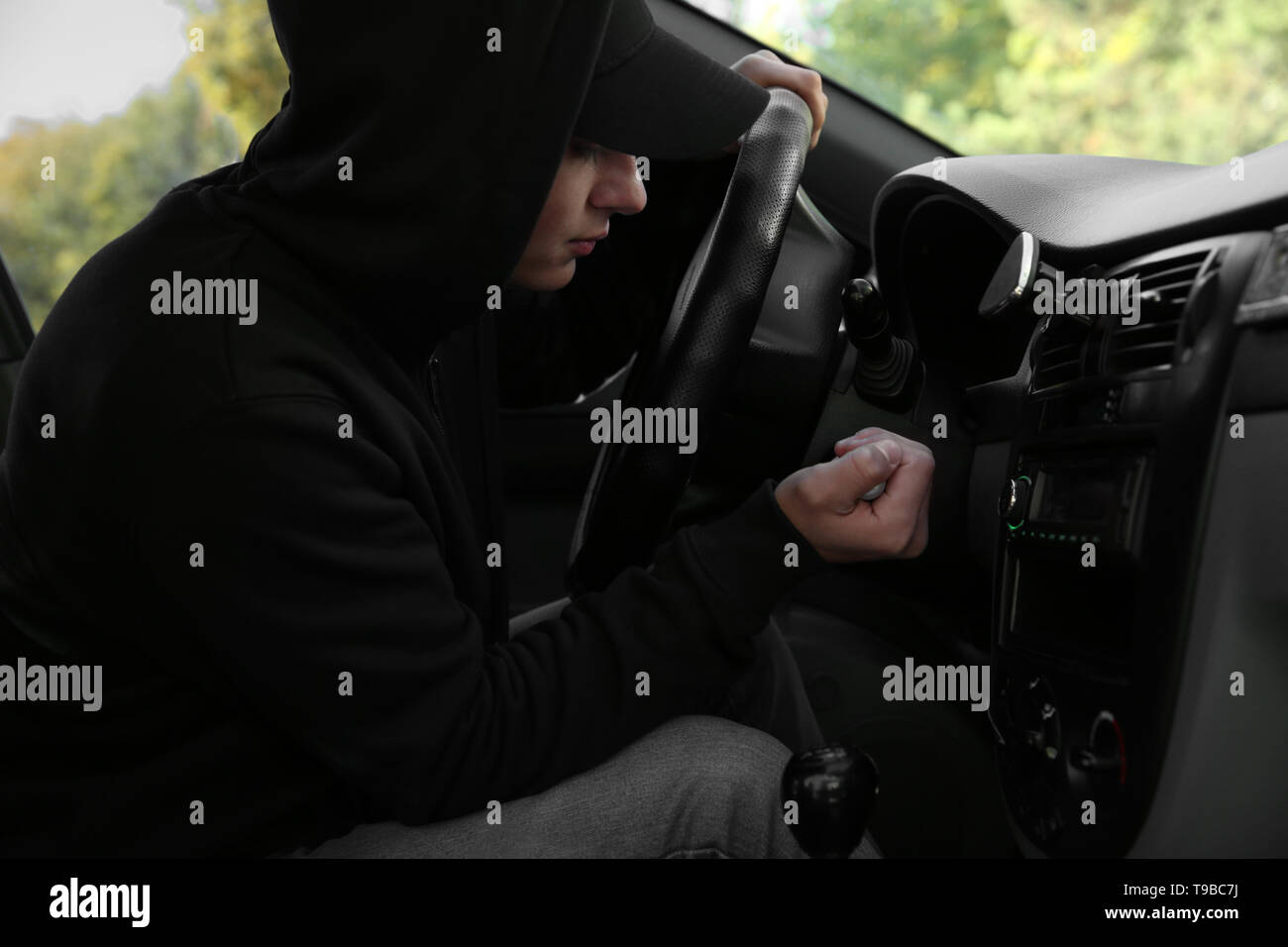 Car thief in action hi-res stock photography and images - Alamy