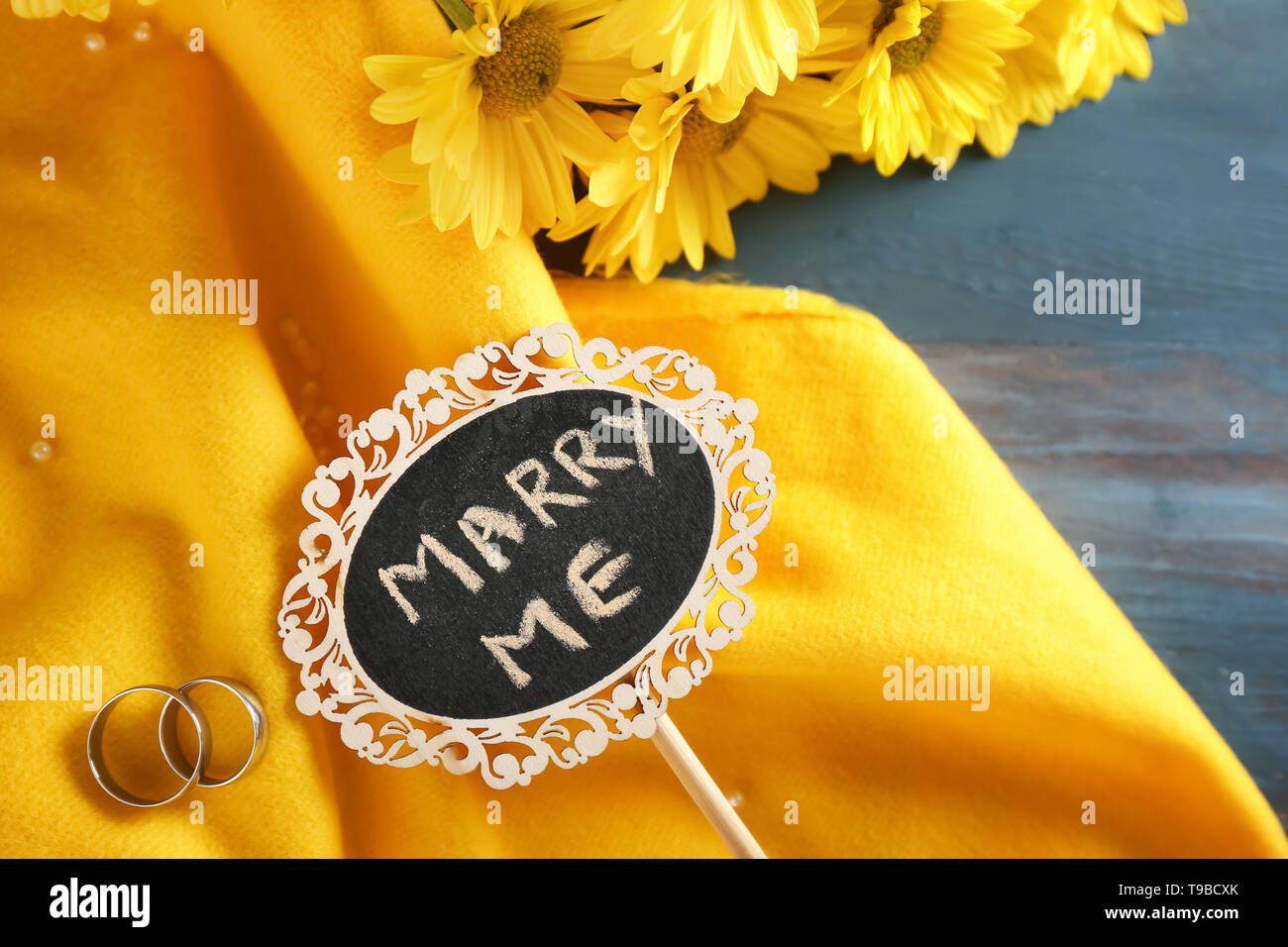 Composition with engagement rings on table Stock Photo - Alamy