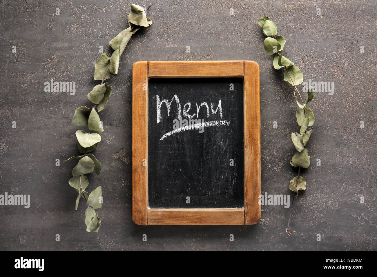 Menu board on grey table Stock Photo - Alamy