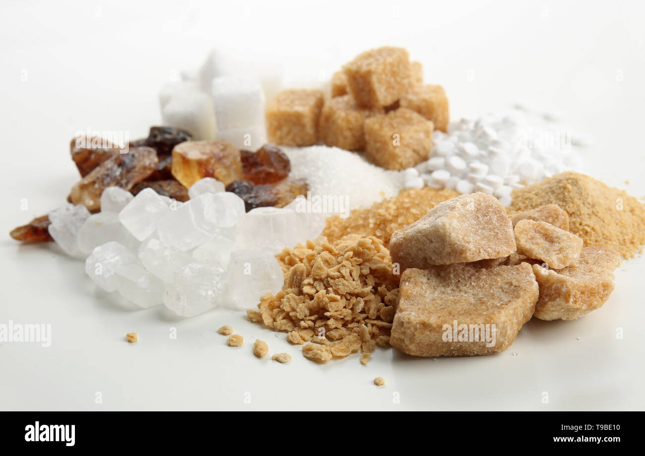 Different kinds of sugar on white background Stock Photo - Alamy