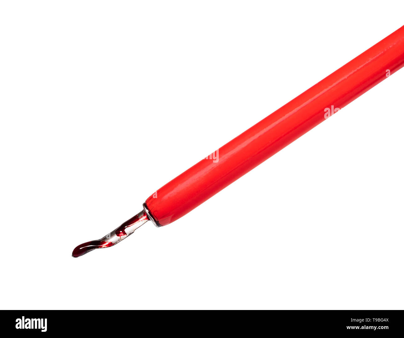 side view of big red ink drop on pointed nib of dip pen cut out on ...