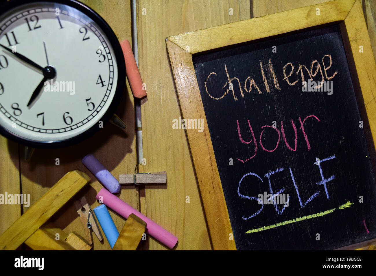 Challenge yourself on phrase colorful handwritten on chalkboard and ...