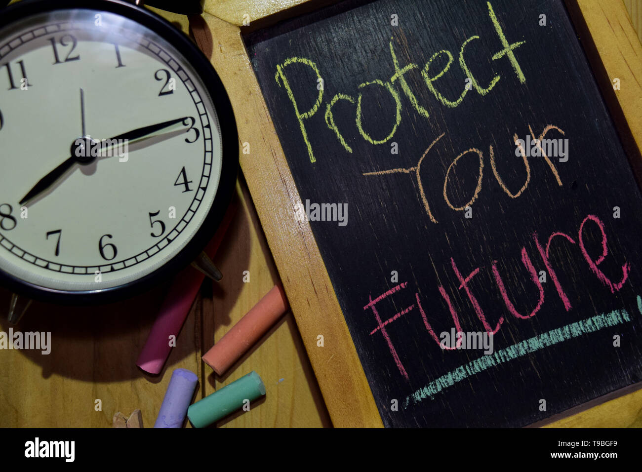 Protect Your Future on phrase colorful handwritten on chalkboard and ...