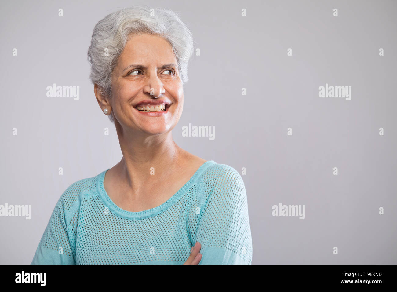 Portrait of confident senior woman smiling Stock Photo - Alamy