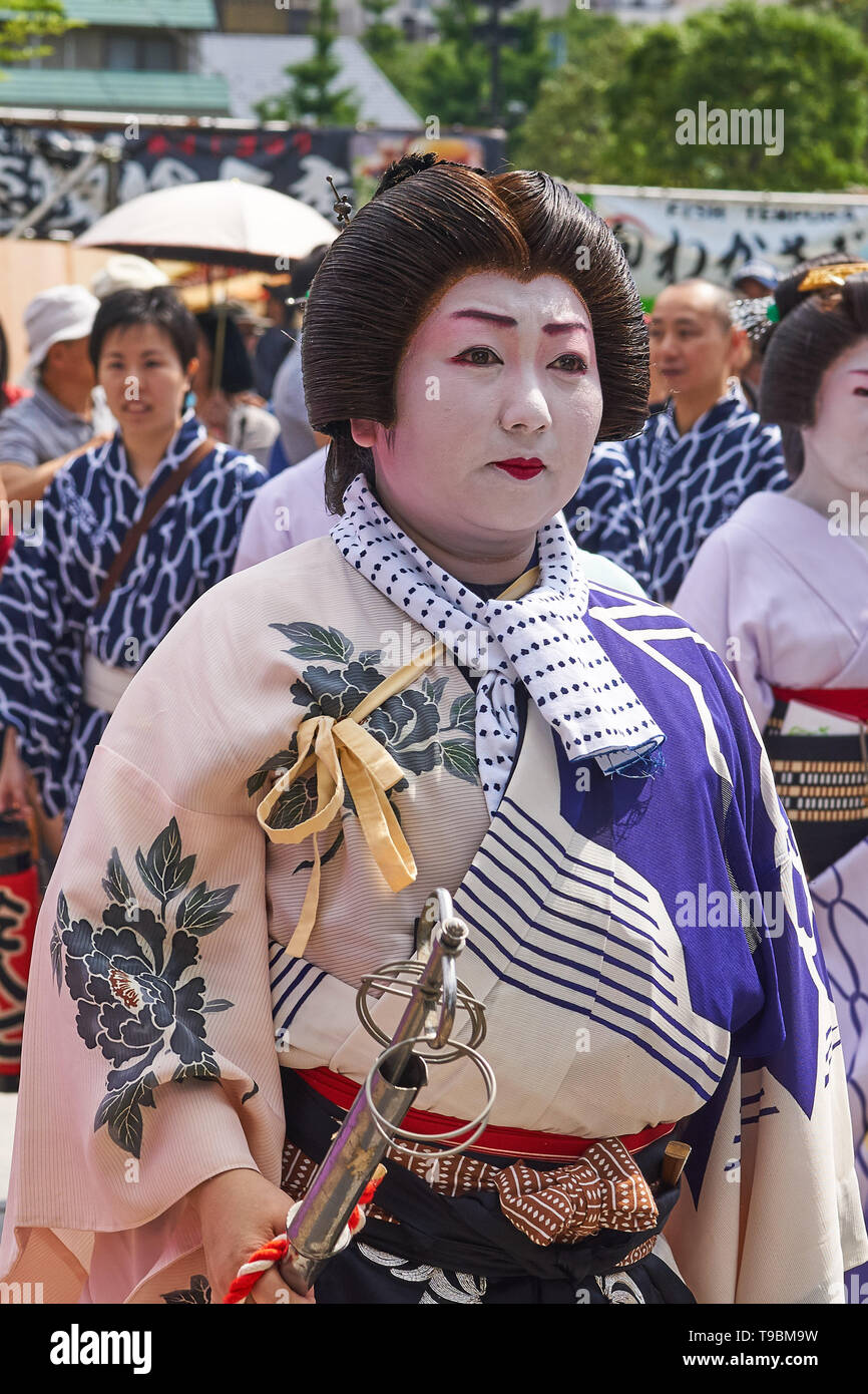 Japanese female kanabohiki (metal rod bearer) with shimada momoware ...