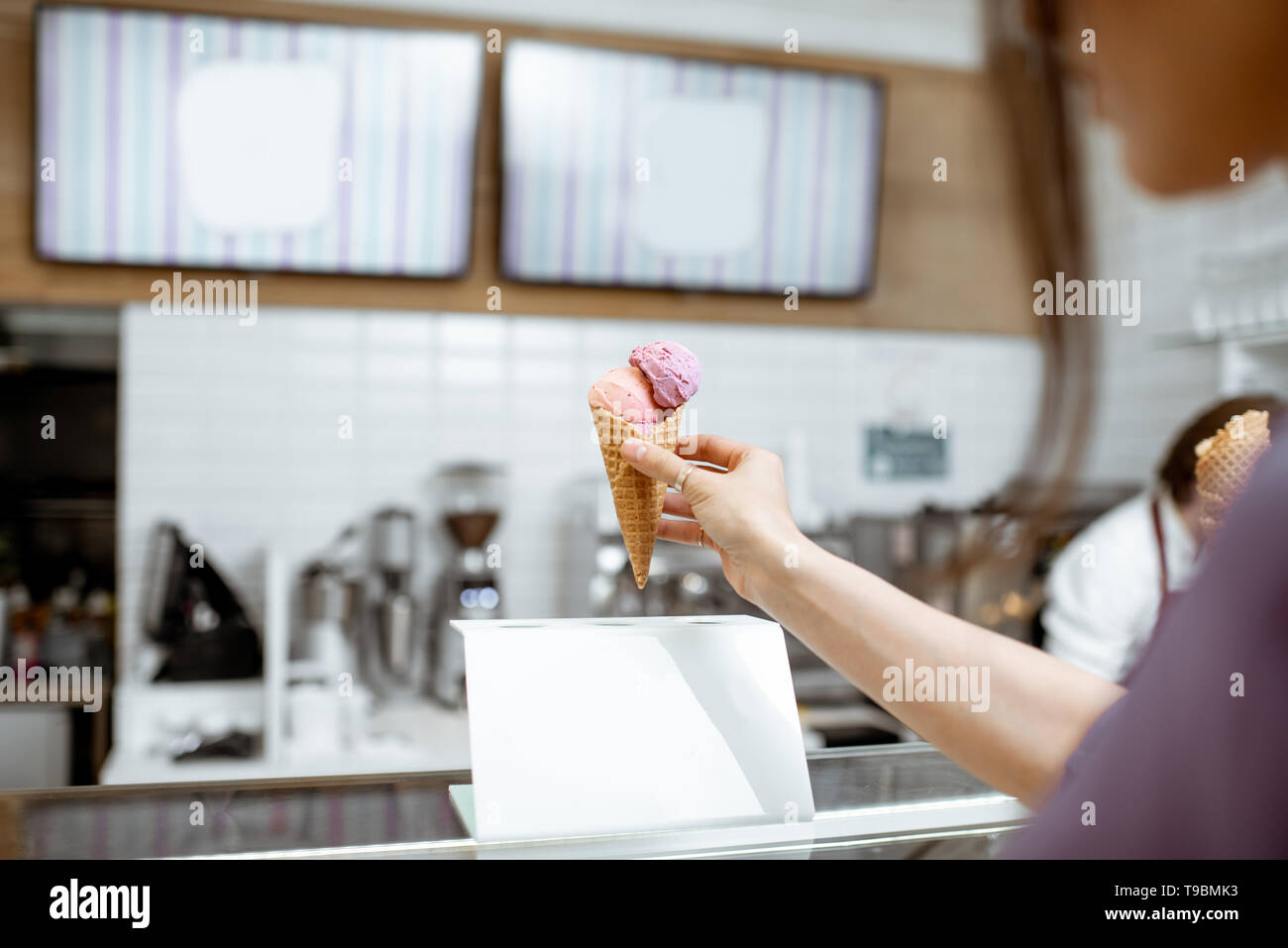 Buying ice cream cone hi-res stock photography and images - Alamy