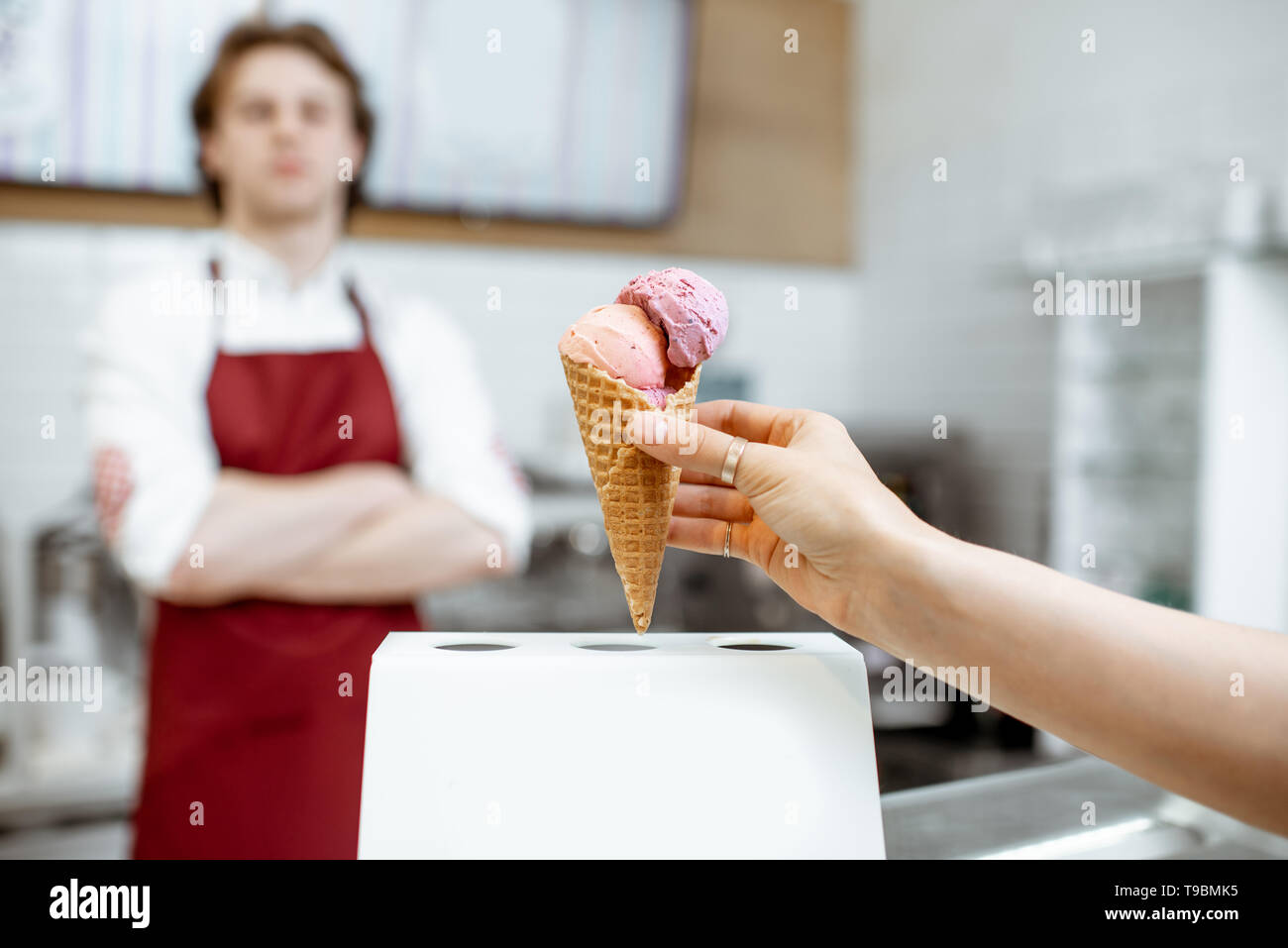 Buying ice cream cone hi-res stock photography and images - Alamy