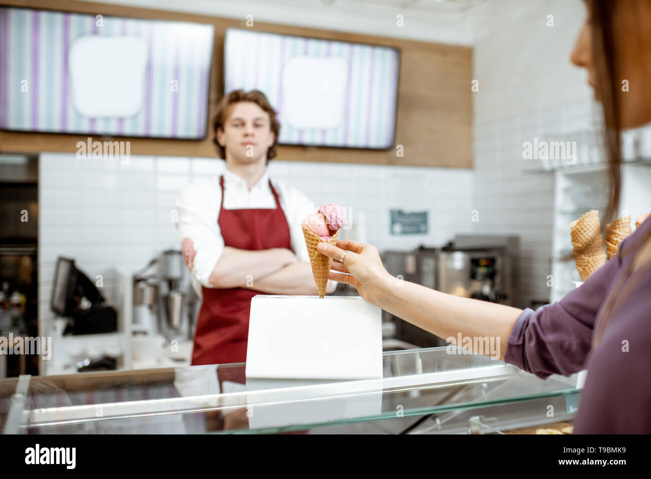 Buying ice cream cone hi-res stock photography and images - Alamy