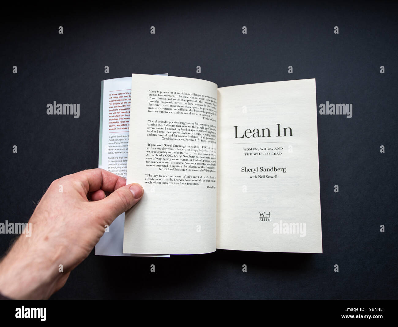 Paris, France - Feb 17, 2017: Male hand reading open Lean in book by ...