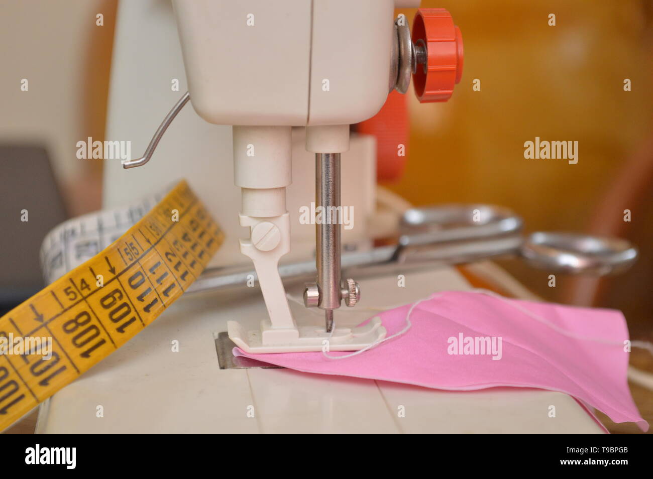 clothes sewing machine tailoring fashion tailor Stock Photo - Alamy