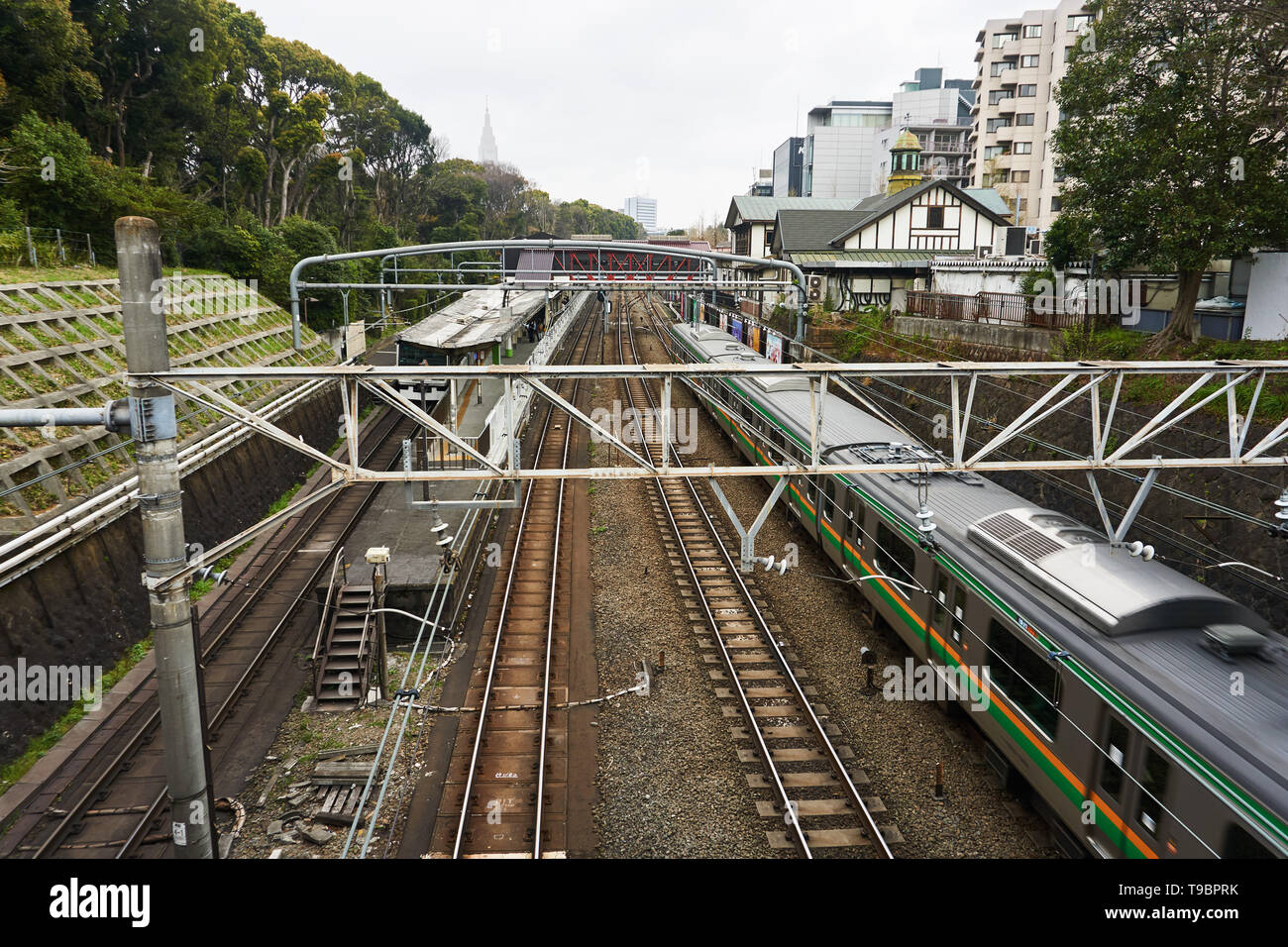 Train lines and moving trains at JR Harajuku Station, in Tokyo, Japan ...