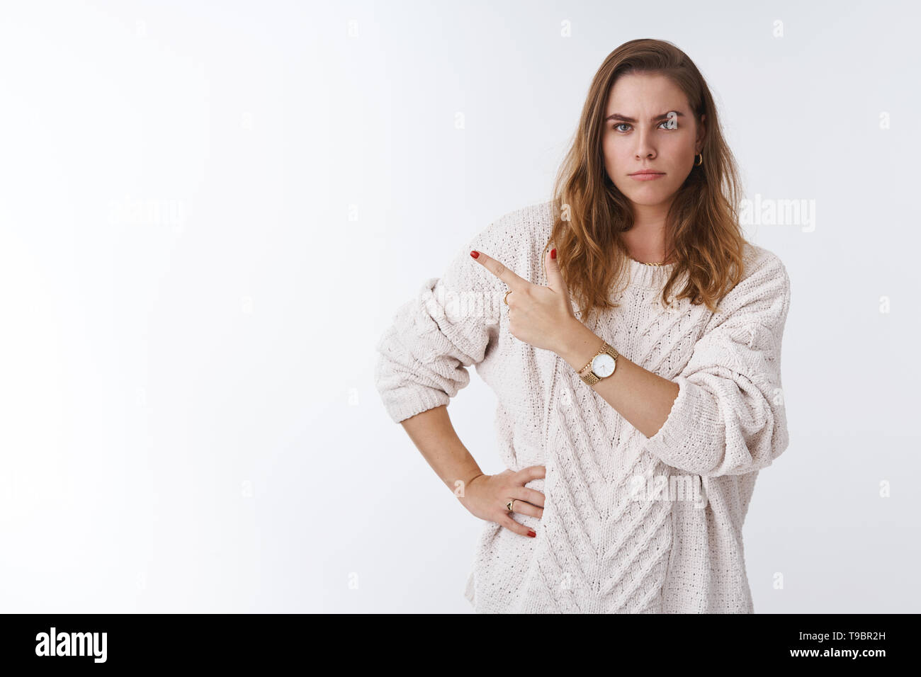 Gorgeous sulking girlfriend demanding answers pointing displeased ...