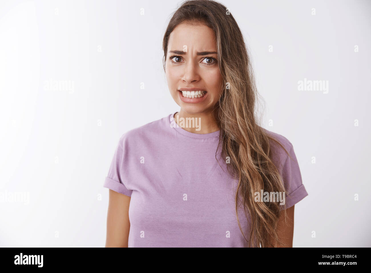 Girl awkward hearing disturbing displeasing story details clenching ...