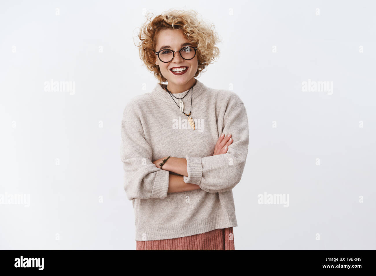 Portrait of bright and enthusiastic hipster girl wearing makeup and ...
