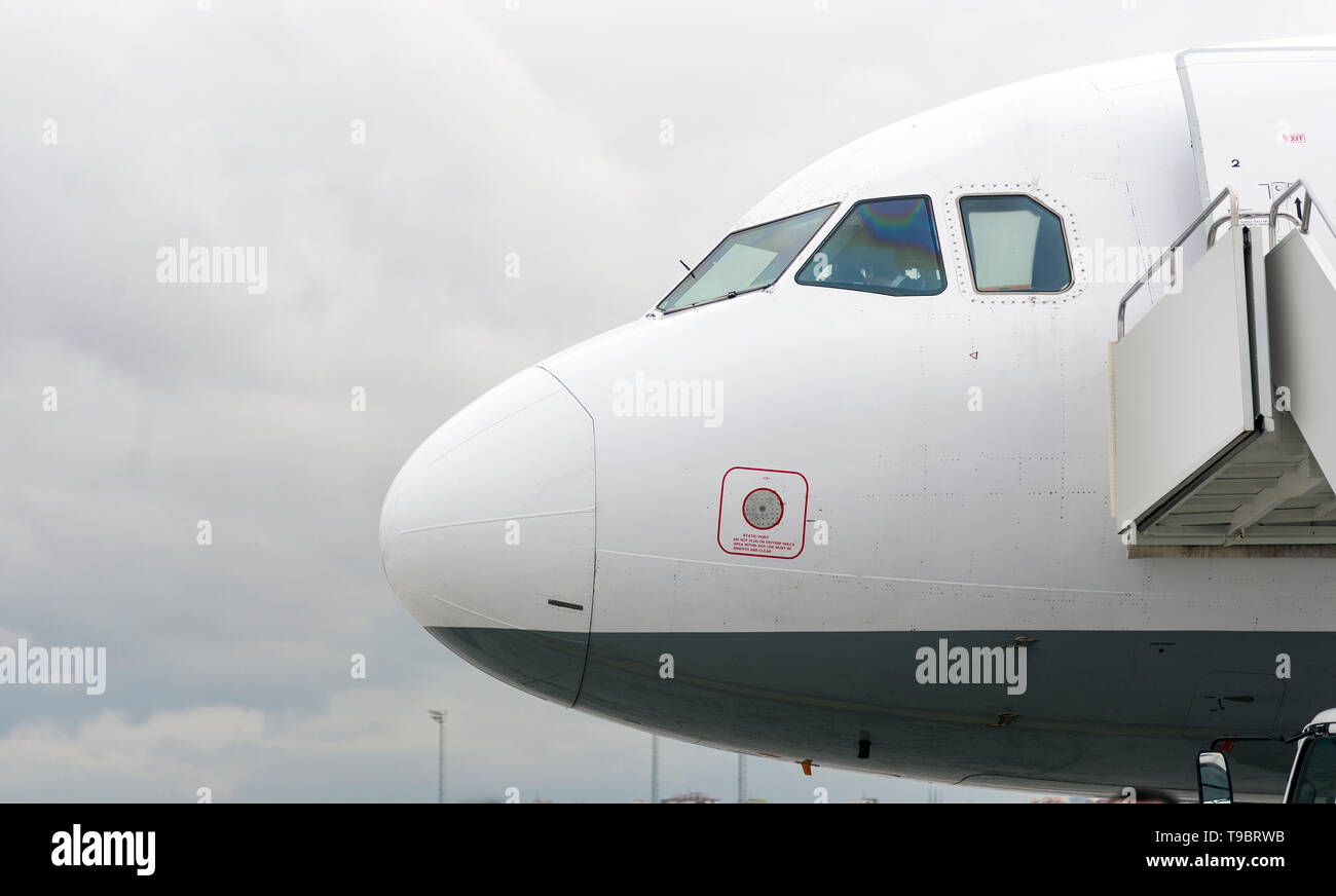 Nose of a Commercial airplane with ladder Stock Photo - Alamy