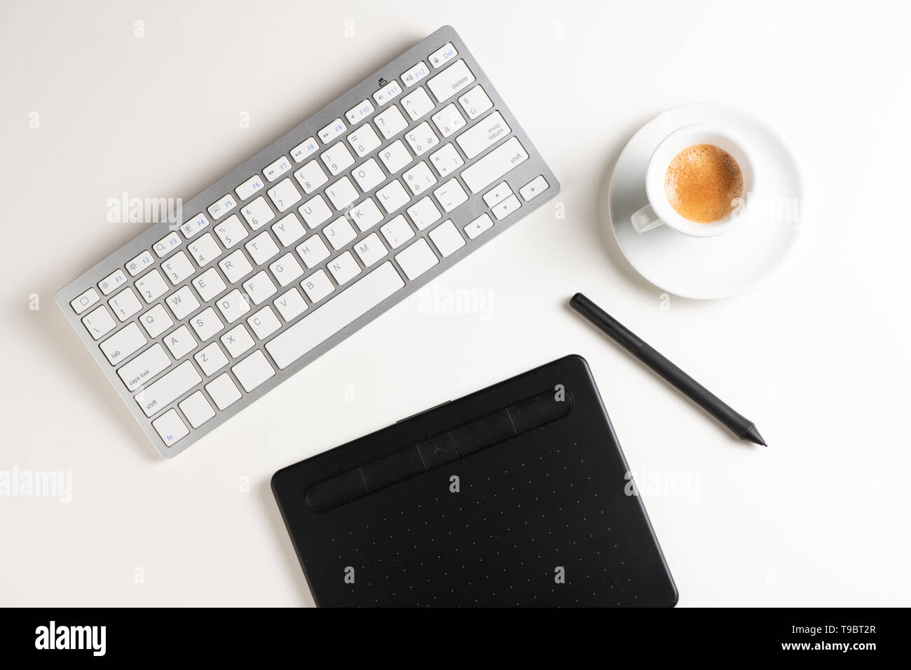 Graphic Designer white work table with computer and coffee. Desk top ...