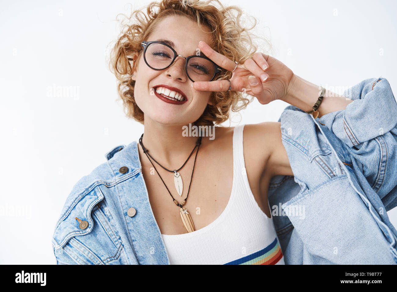 Peace sign over head hi-res stock photography and images - Alamy