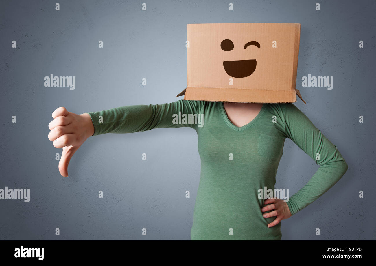 Funny woman wearing cardboard box on her head with smiley face Stock ...
