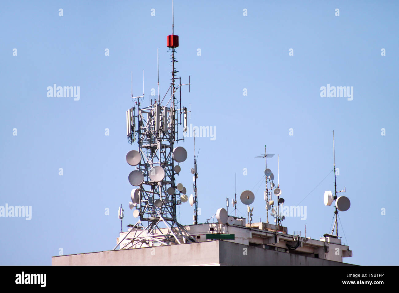 Telecommunication base stations network repeaters on the roof of ...
