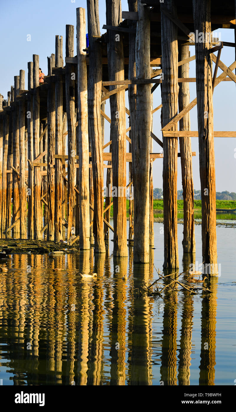 Amarapura, Myanmar - Feb 9, 2017. Local people and tourists walking on ...