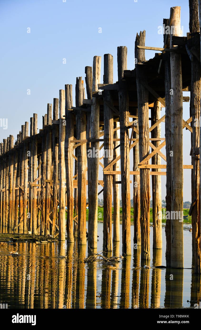 Amarapura, Myanmar - Feb 9, 2017. Local people and tourists walking on ...