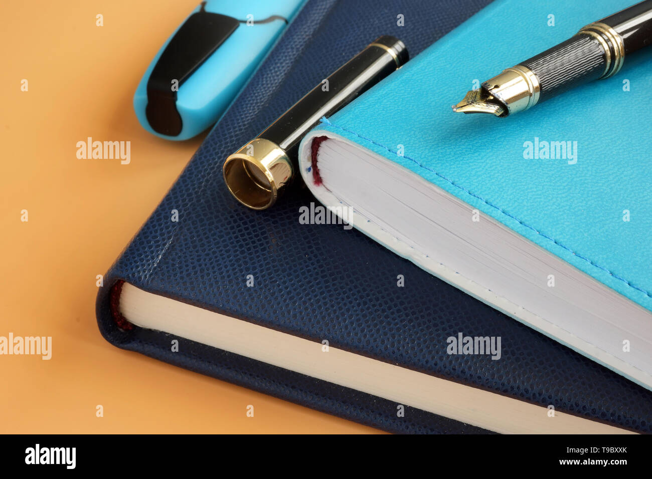 Office supply for business. Notepads and pen Stock Photo - Alamy