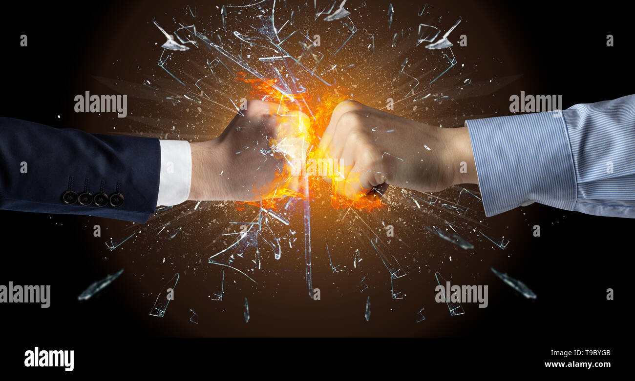 Two hands fighting and breaking a glass into small pieces Stock Photo ...