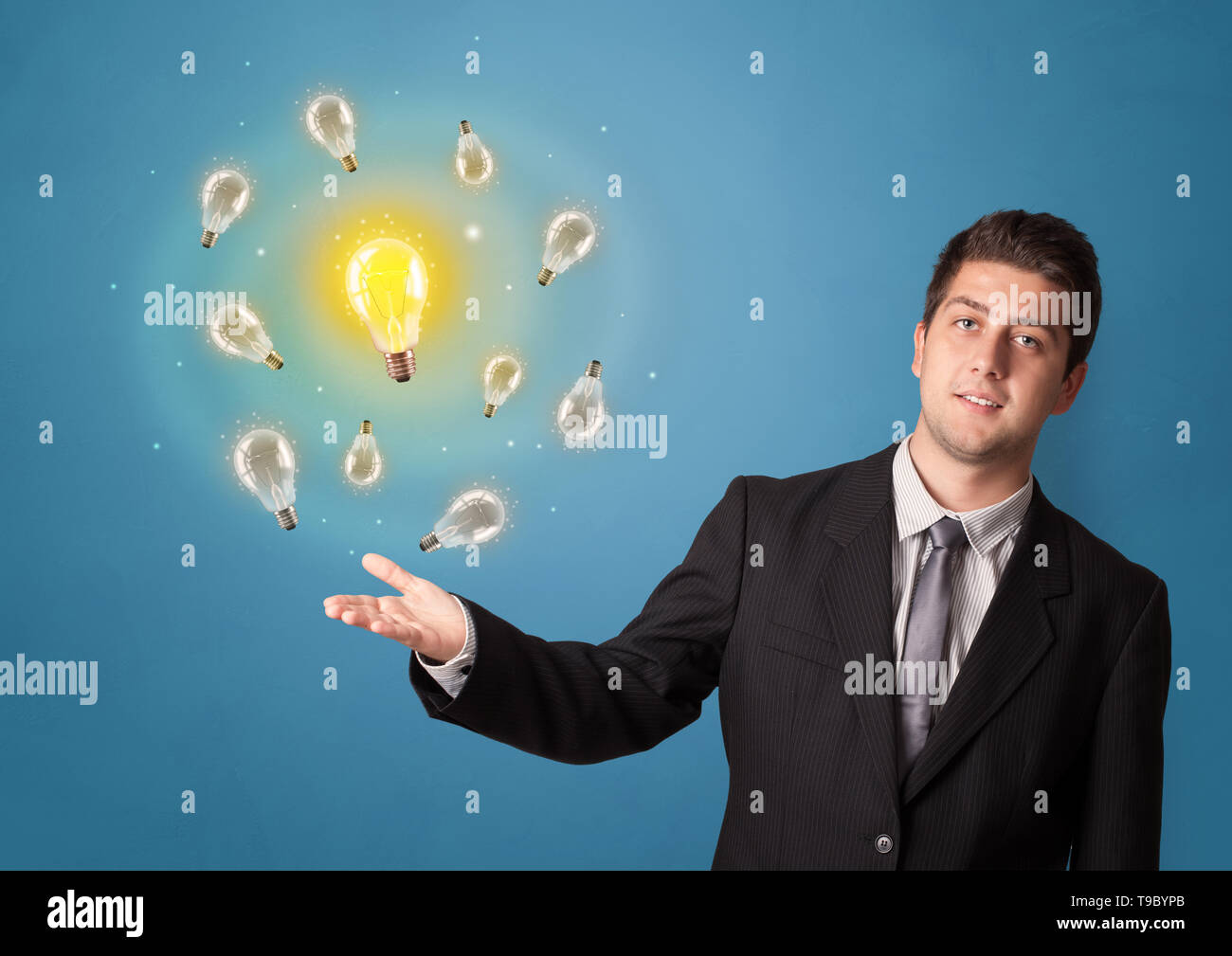 Young smiling person presenting new idea concept Stock Photo - Alamy