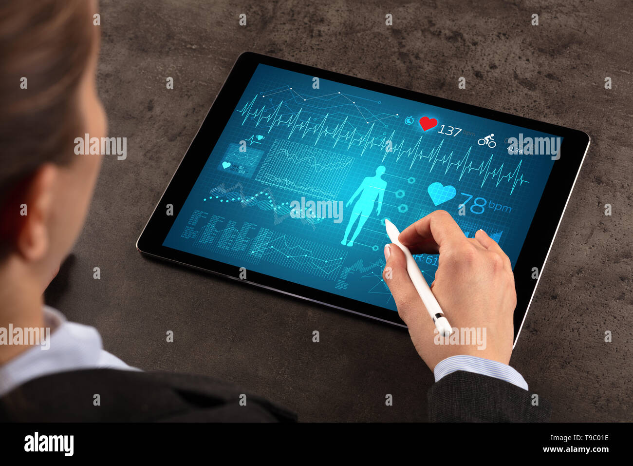Business woman making healthy analysis on tablet Stock Photo - Alamy